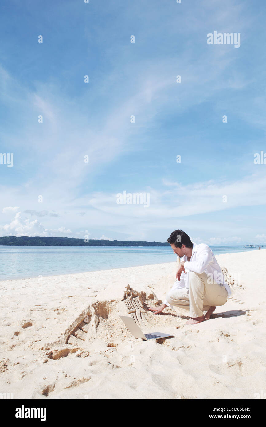 Sandcastle beach adult hi-res stock photography and images - Alamy