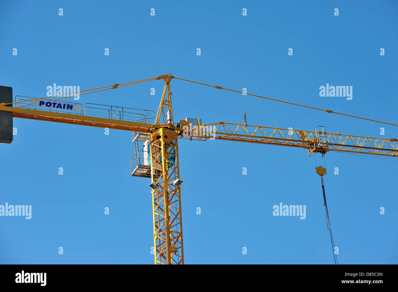 A large Potain yellow crane viewed from ground level in Johannesburg ...