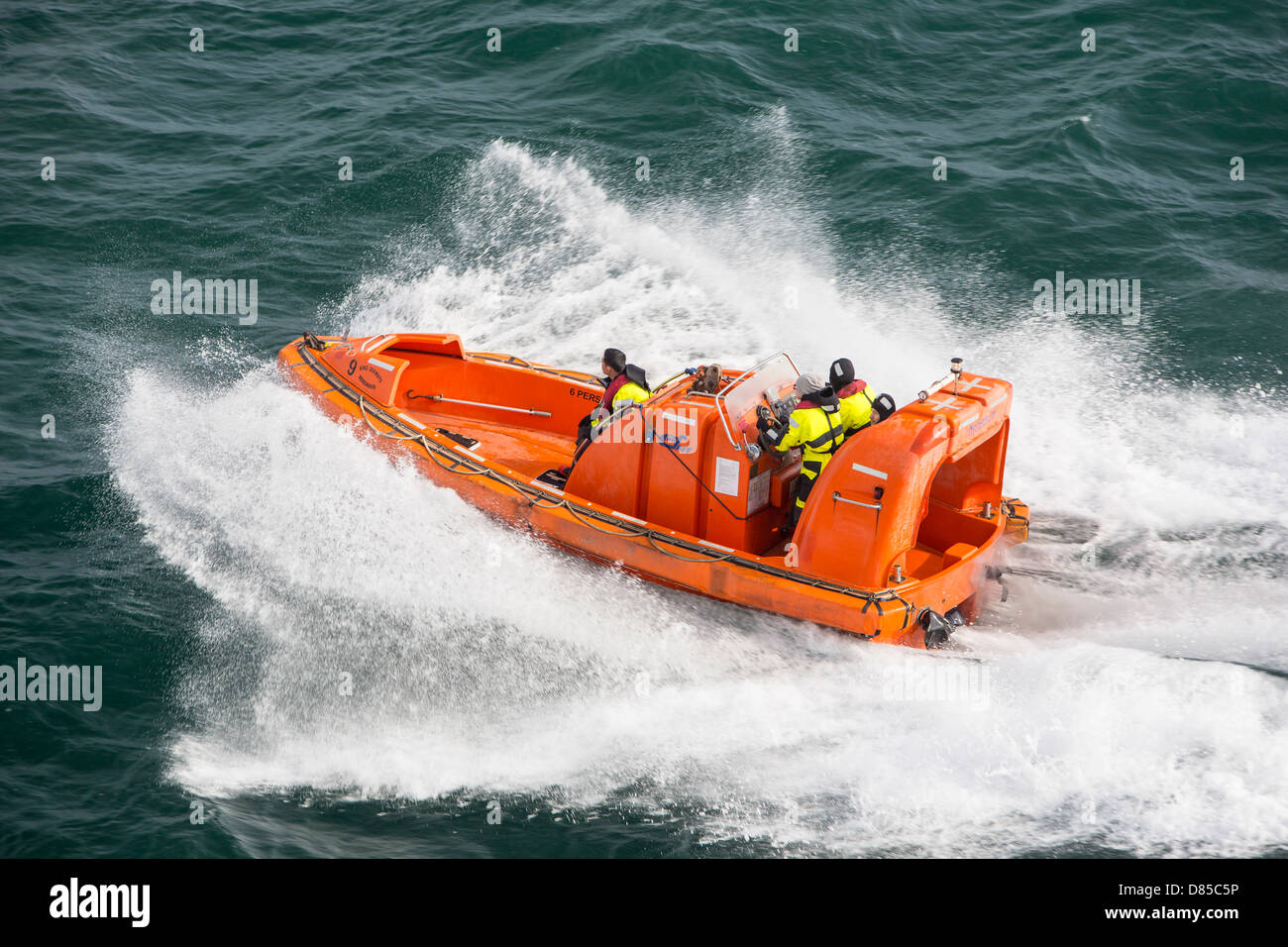 A life boat practising off a north sea ferry as it comes into Newcastle ...