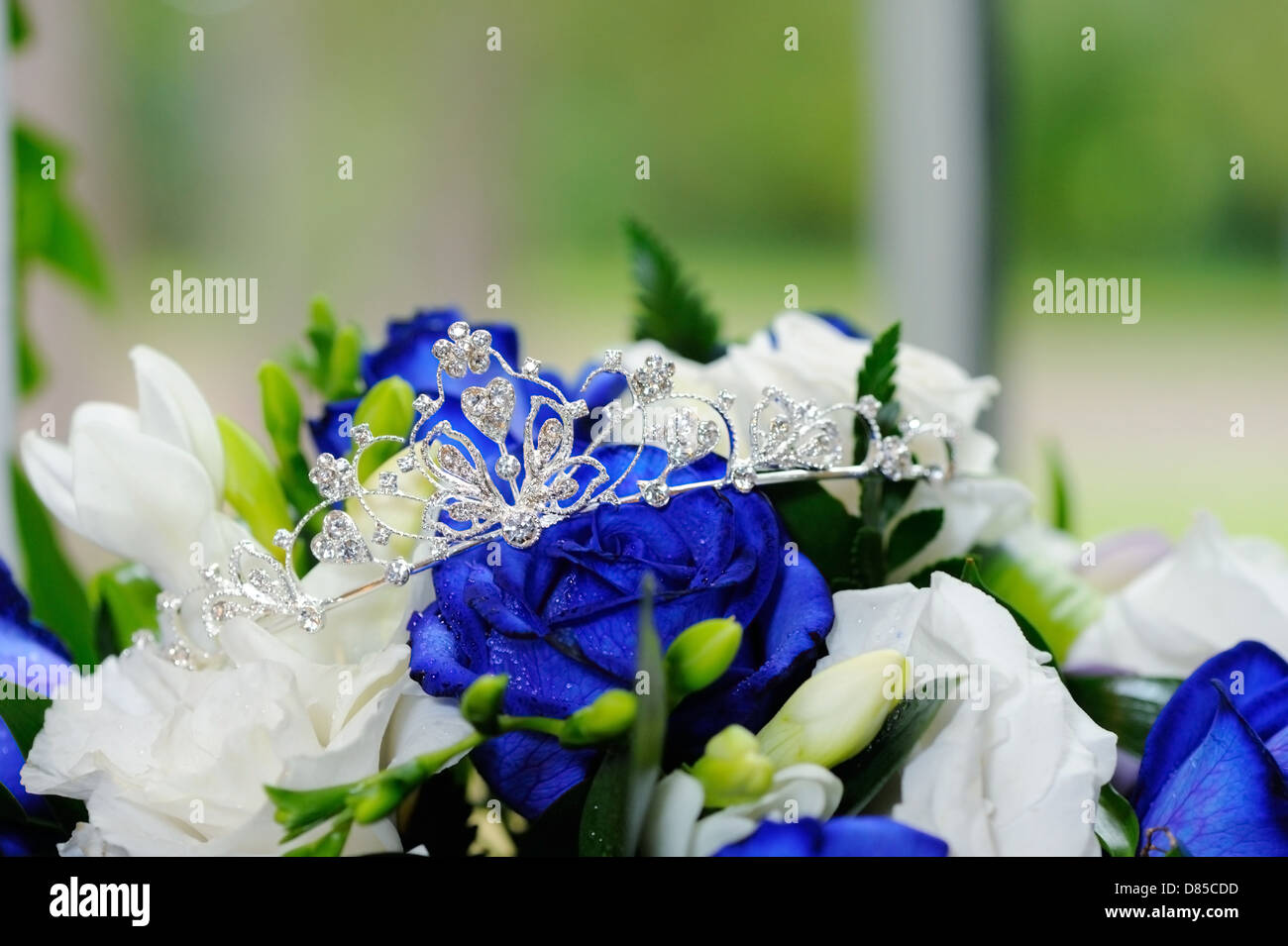 Brides shiny tiara on blue rose bouquet Stock Photo - Alamy