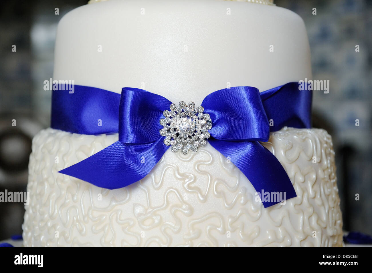 Blue ribbon decorates wedding cake at reception Stock Photo - Alamy