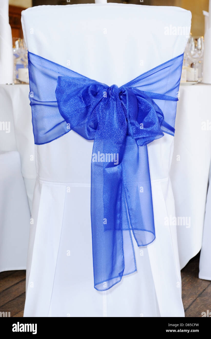Blue ribbon and bow on chair at wedding reception Stock Photo - Alamy