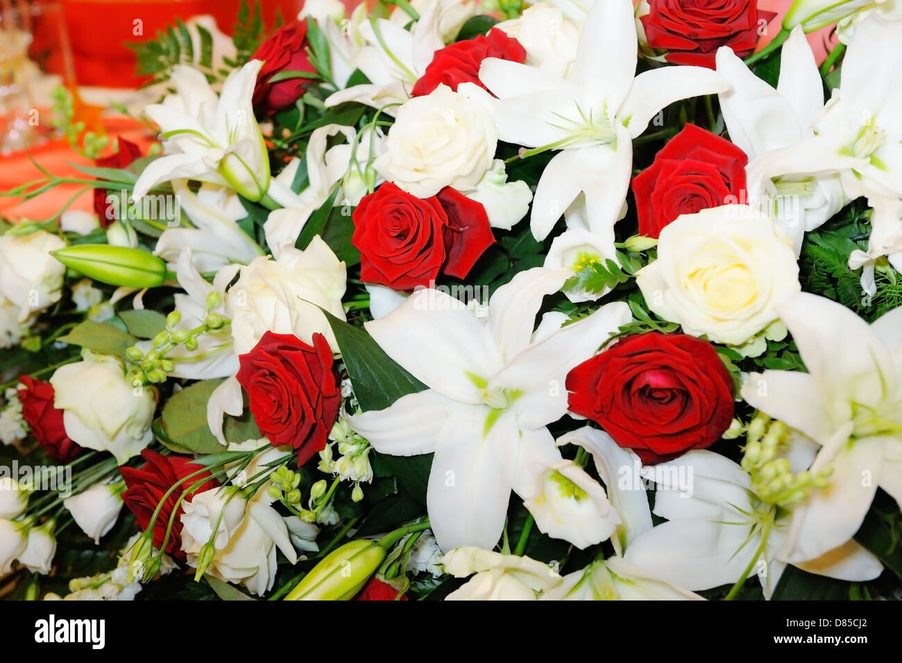 Brides bouquet of red and white roses and lilies Stock Photo - Alamy