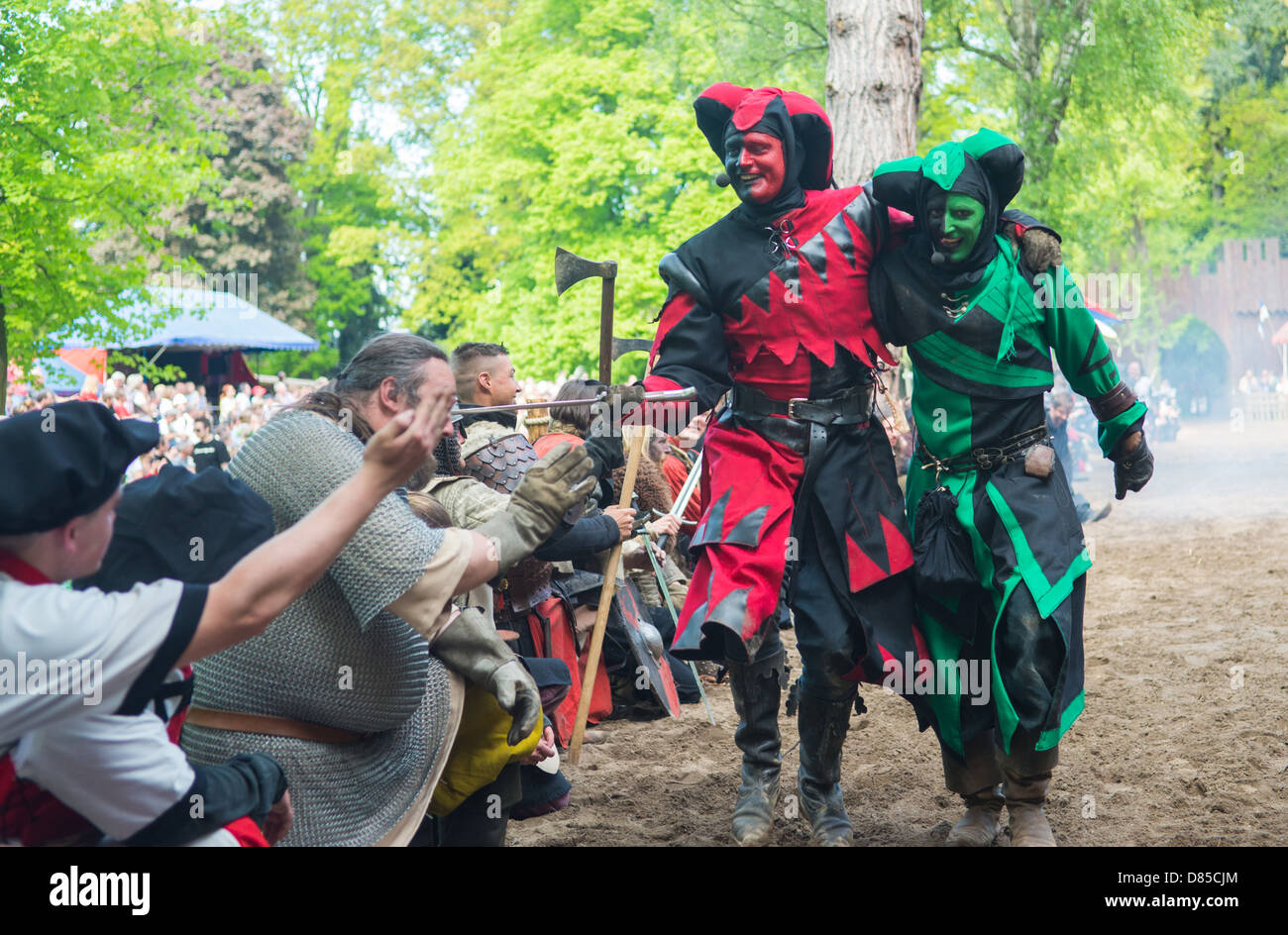 Two fools on the medieval festival Stock Photo - Alamy
