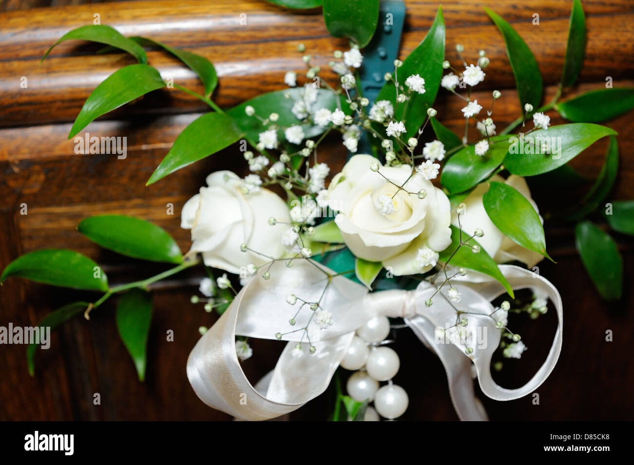 White roses decorate inside of a church on wedding day Stock Photo - Alamy