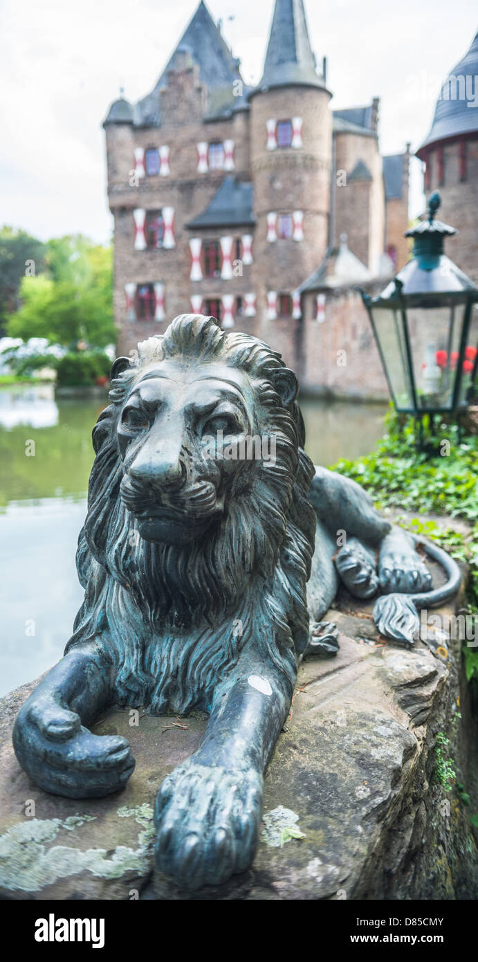 Metal lion and a medieval castle Stock Photo - Alamy