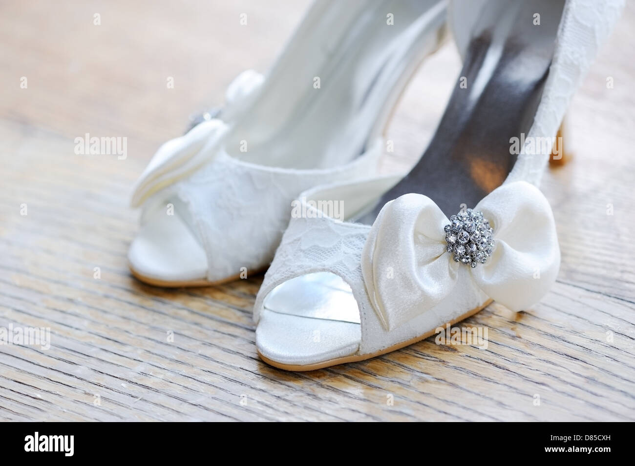 Brides white shoes closeup on wedding day Stock Photo - Alamy