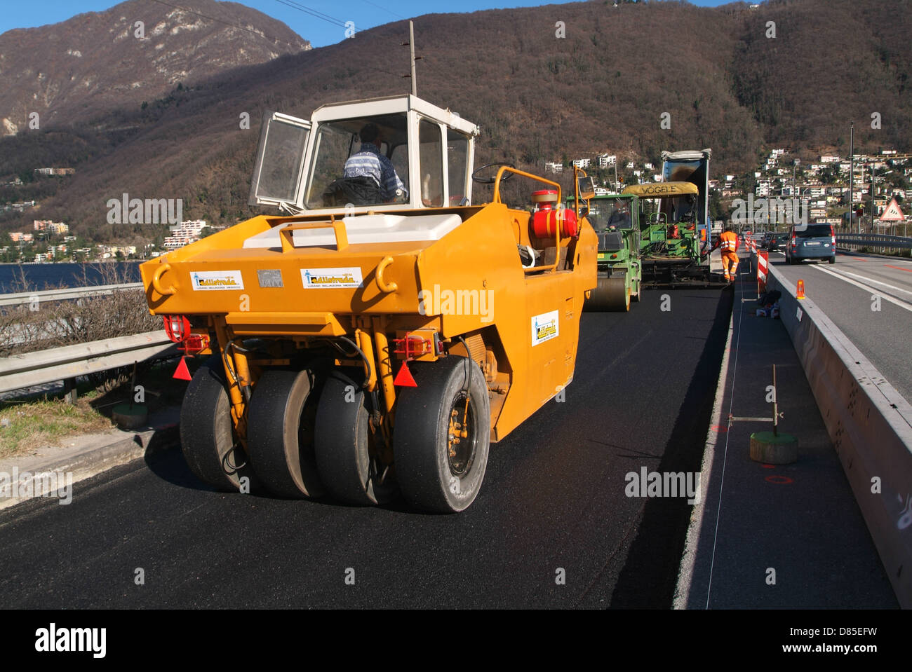 Paving works on a highway Stock Photo - Alamy
