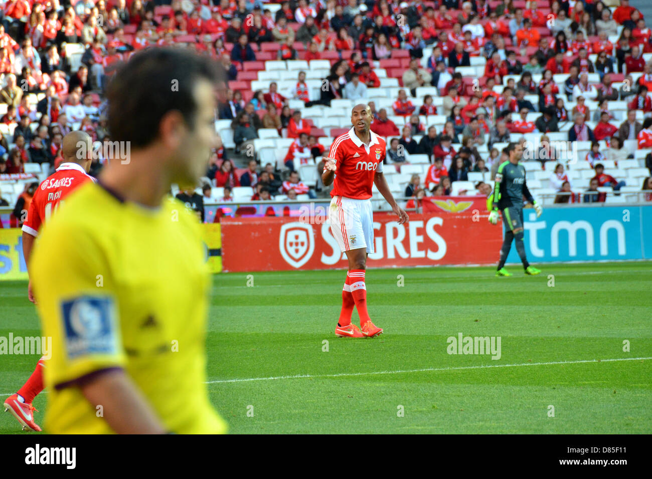 Benfica player and captain Luisao give directions to Maxi player after ...