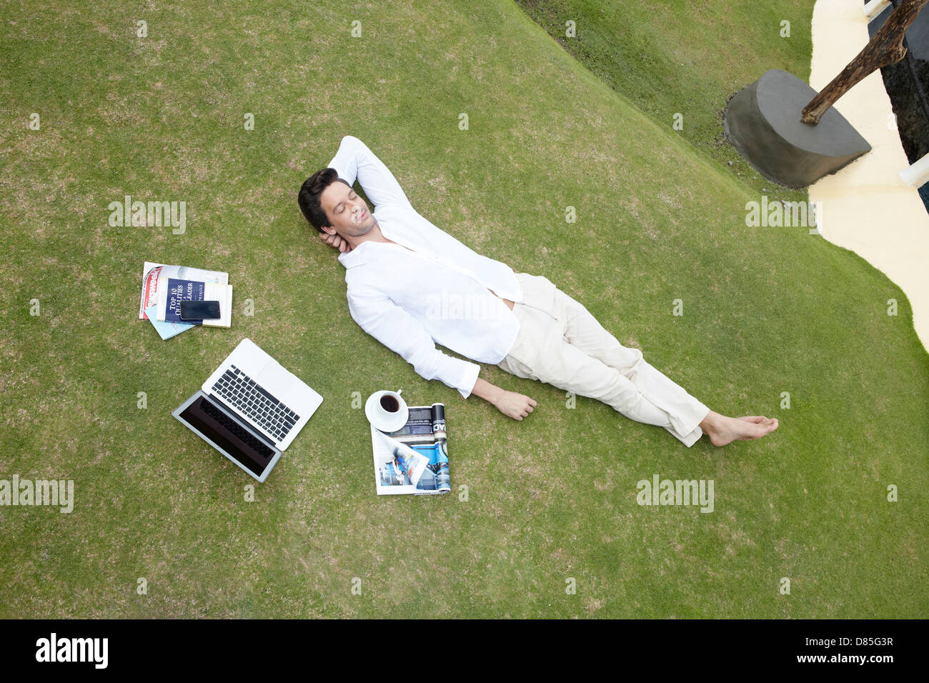 man lying on his back on grass Stock Photo - Alamy