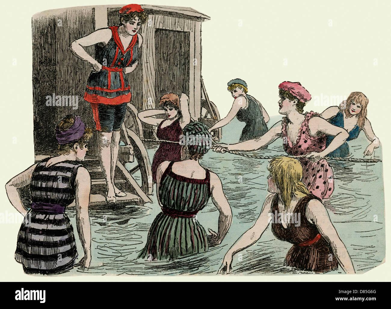 Bathing Machines And Women Paddling At The Beach Stock Photo - Alamy