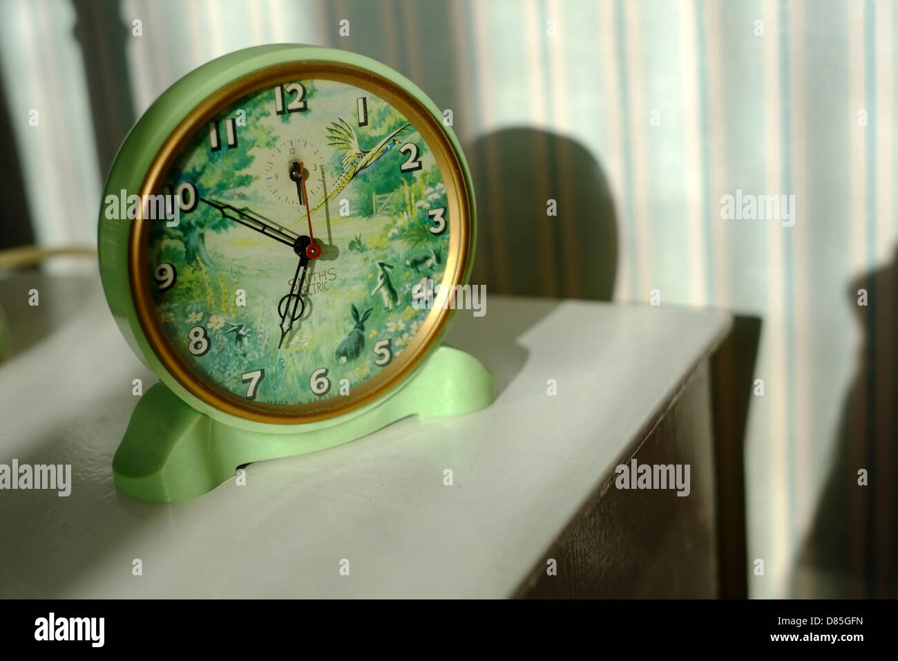 A vintage Smith Sectric alarm clock in the early morning sun Stock ...