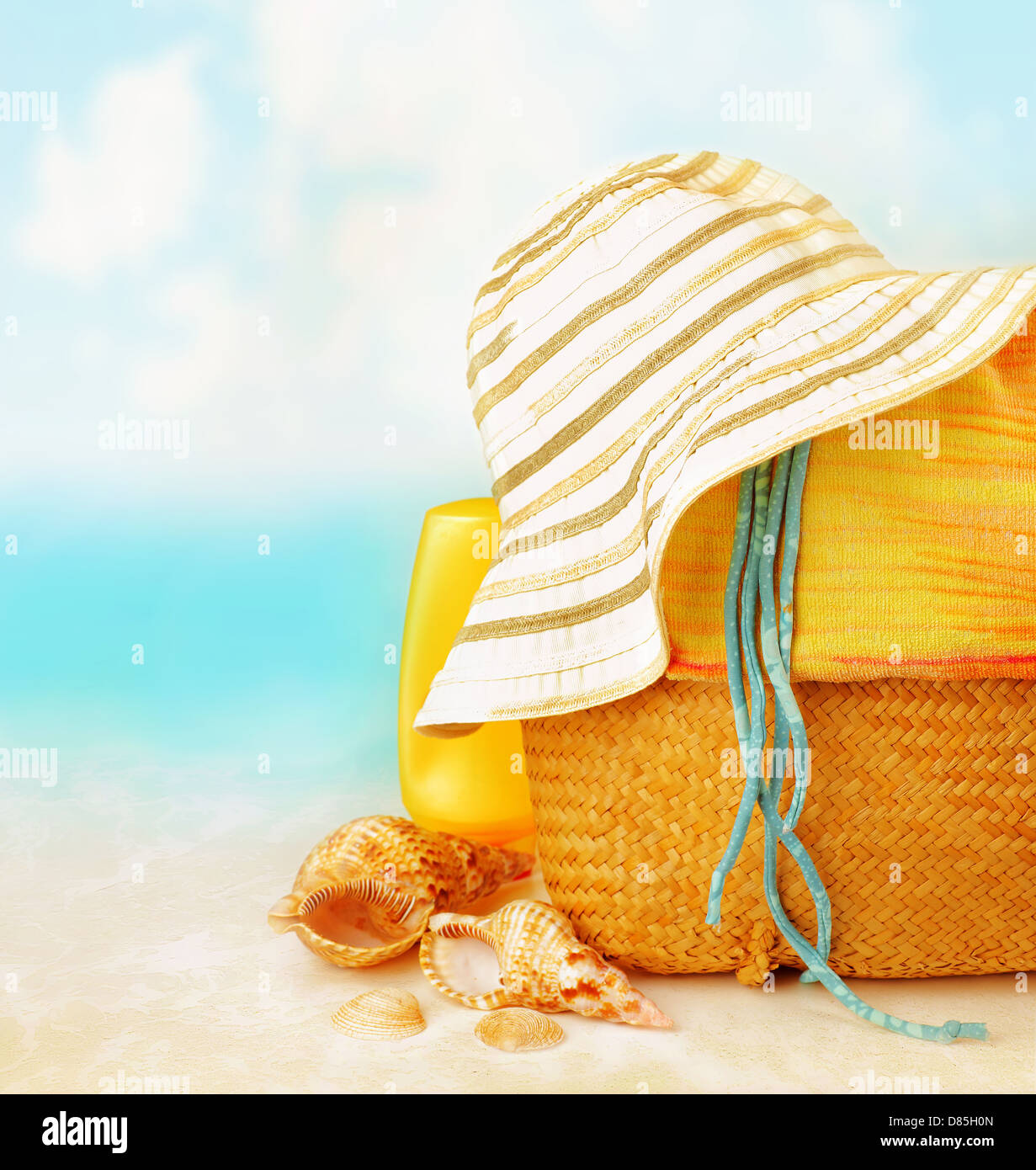 Beach accessories on the sand near sea, skin protection, seashell, hat ...
