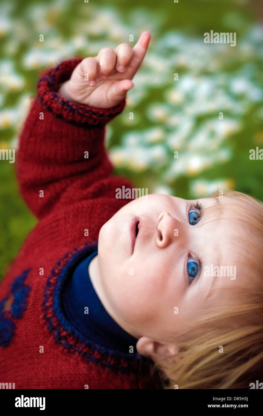 Baby girl pointing up Stock Photo - Alamy