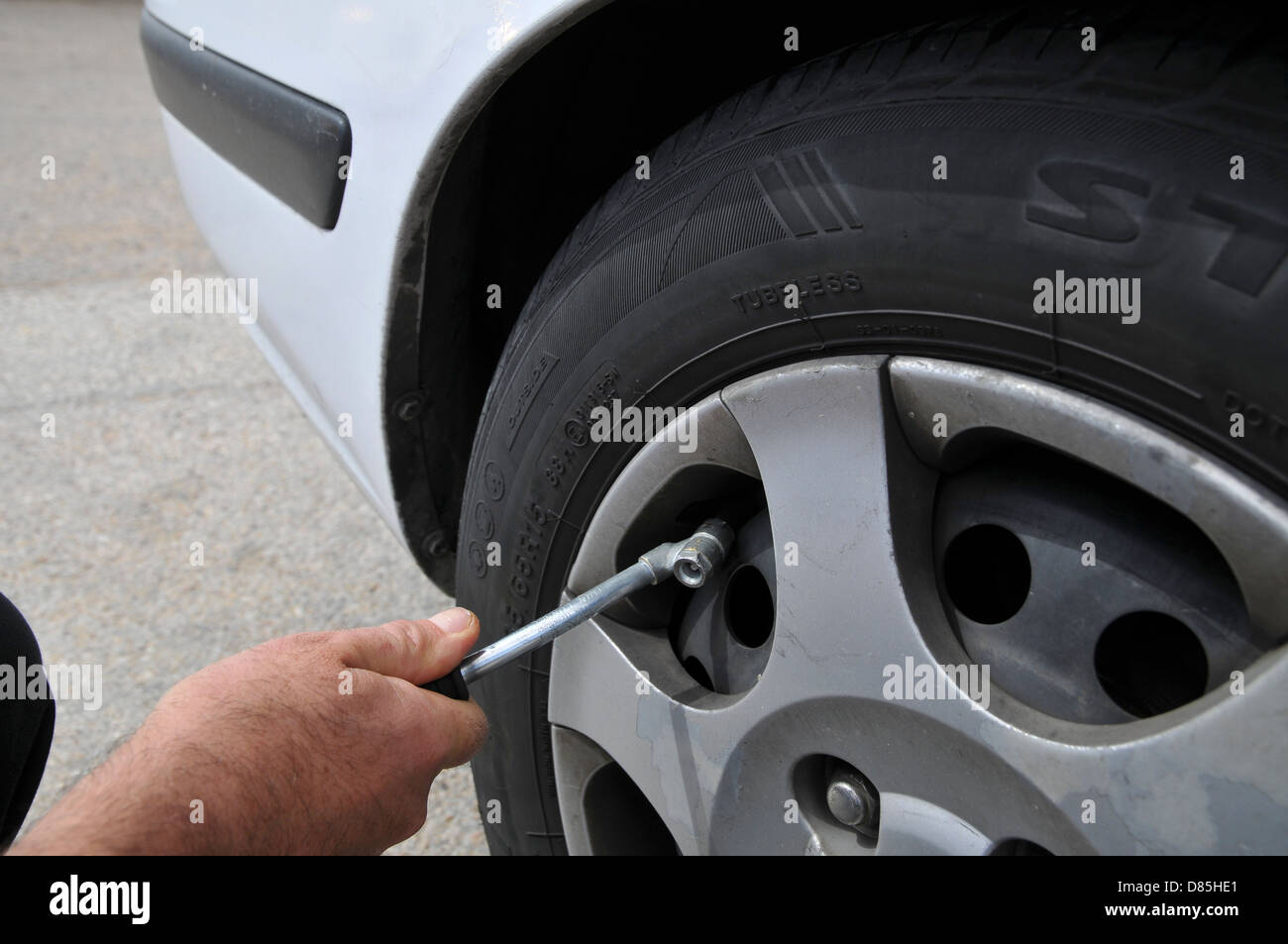 Inflating tyre hi-res stock photography and images - Alamy