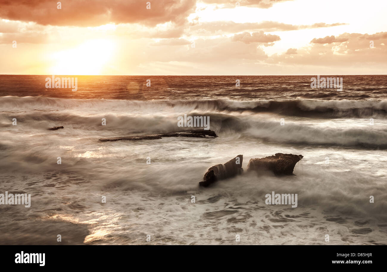 Sunset over rocky coastline hi-res stock photography and images - Alamy