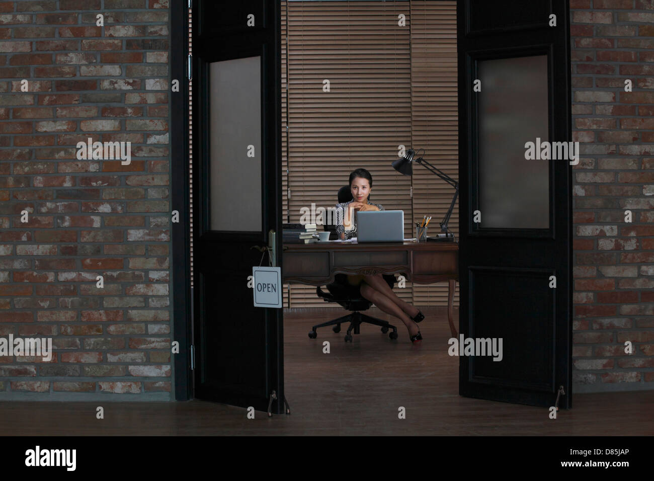 young woman sitting desk computer Stock Photo - Alamy