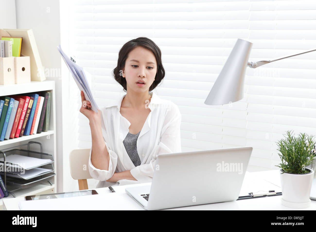 young woman sitting desk computer Stock Photo - Alamy