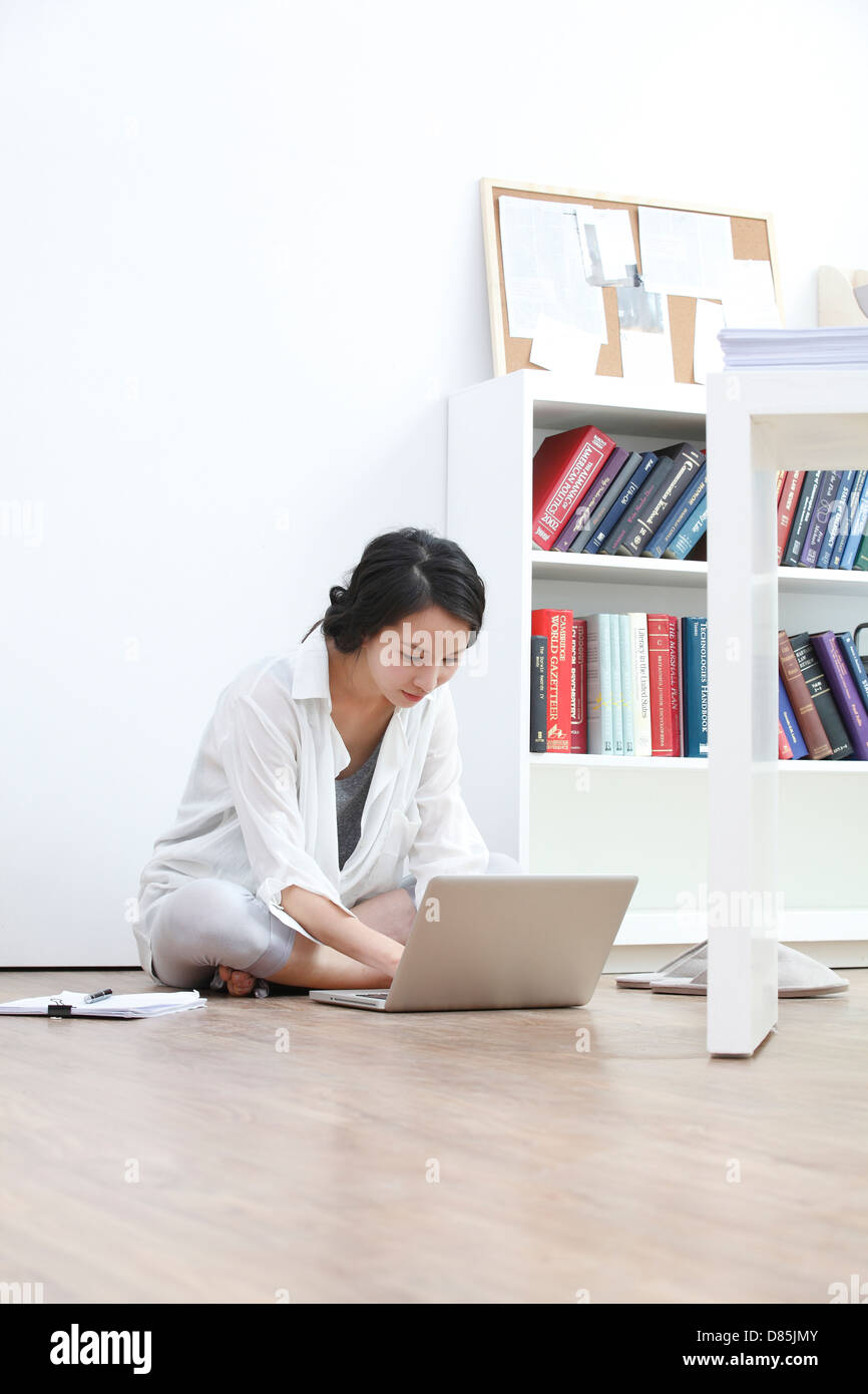 young woman sitting laptop computer Stock Photo - Alamy