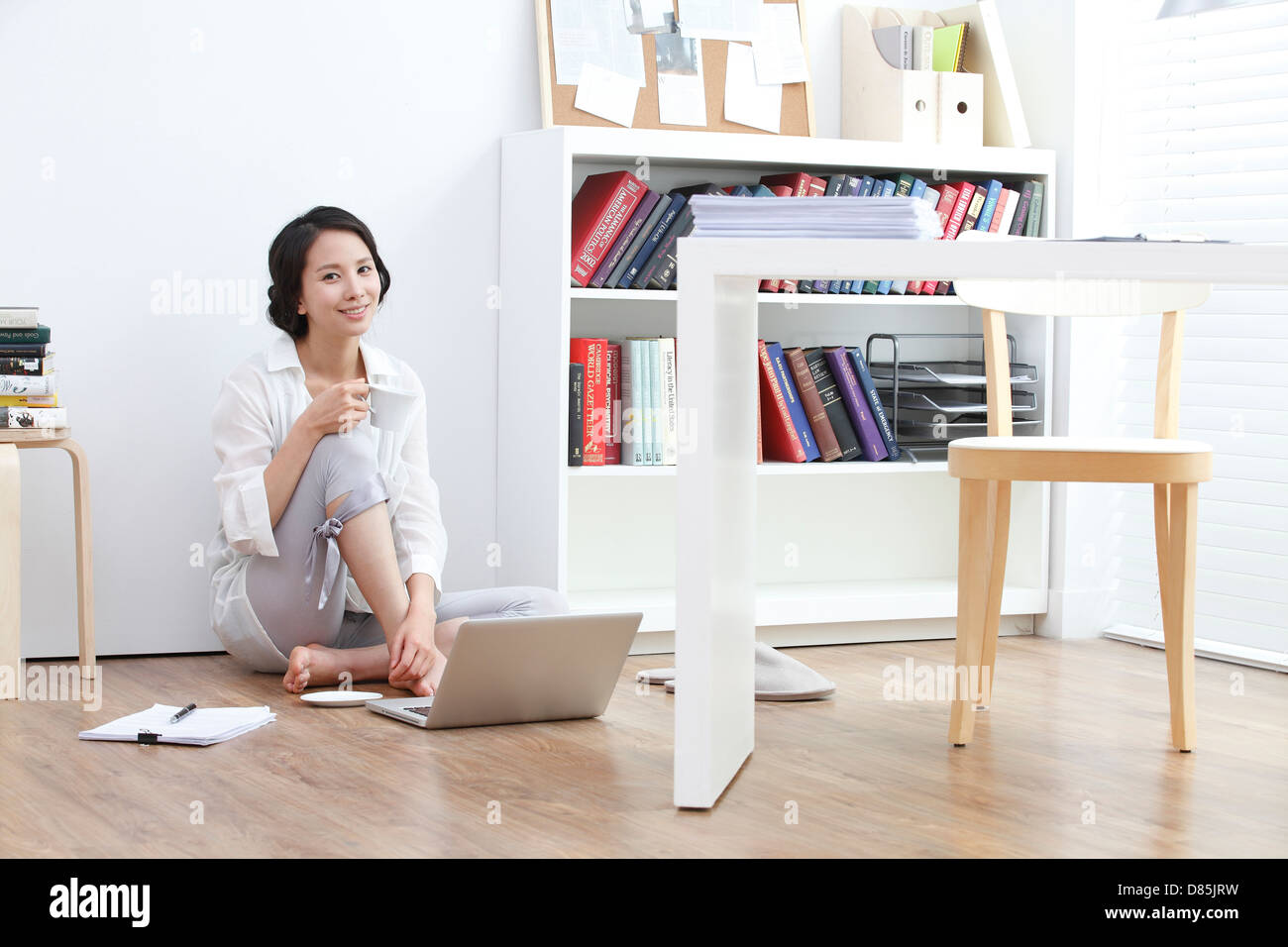 young woman sitting laptop computer Stock Photo - Alamy