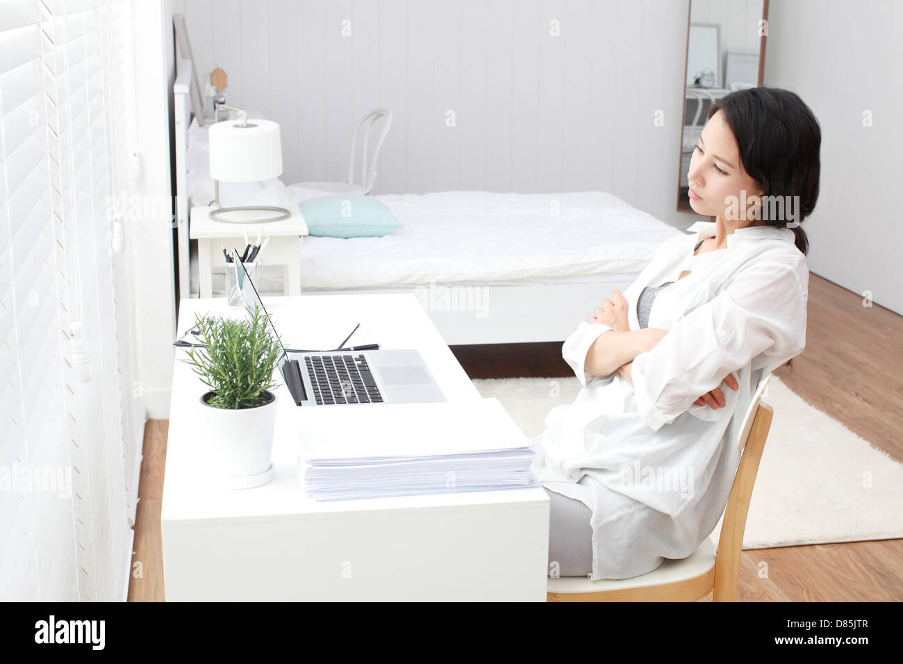 young woman looking computer Stock Photo - Alamy