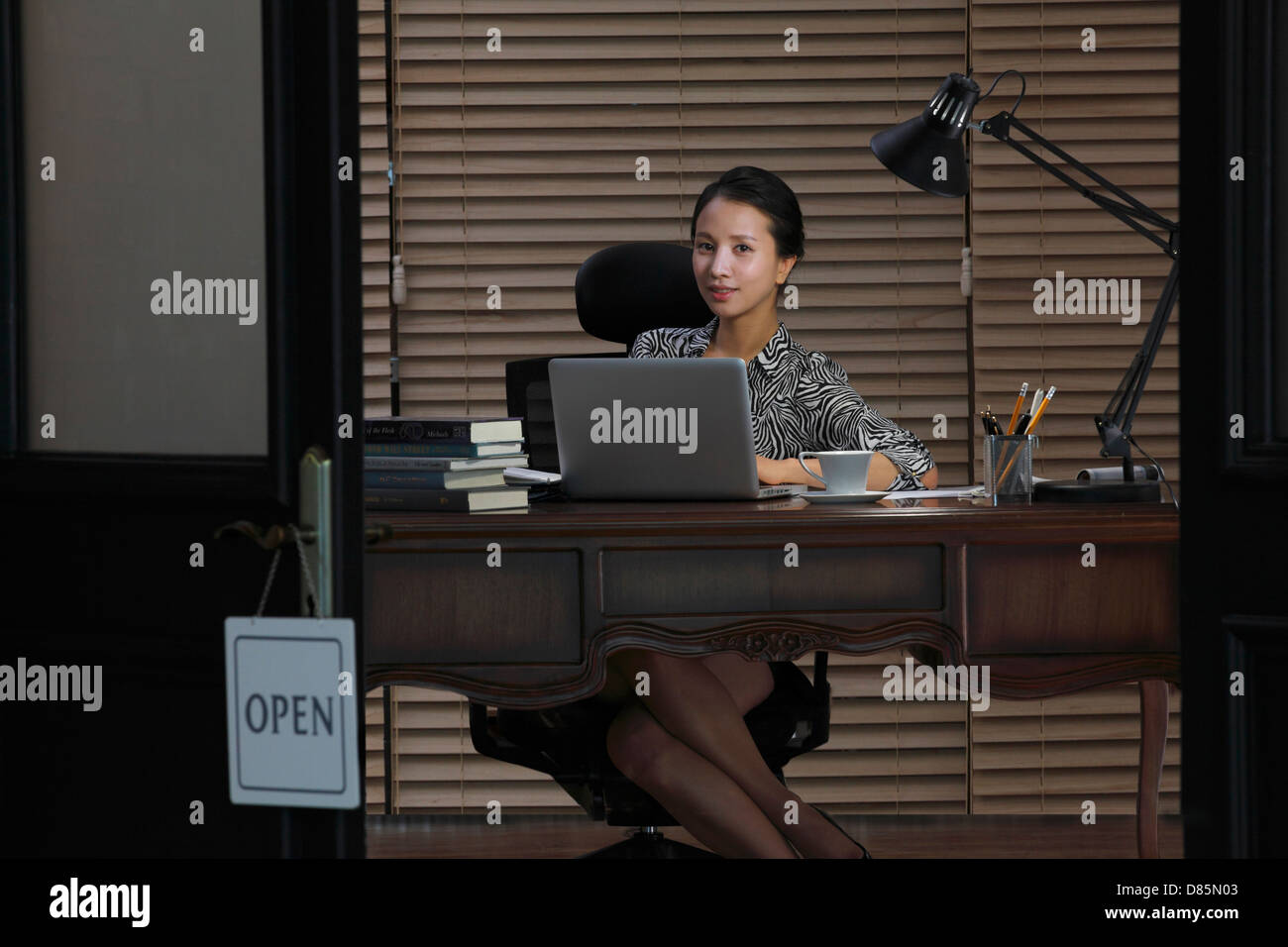 young woman sitting desk computer Stock Photo - Alamy