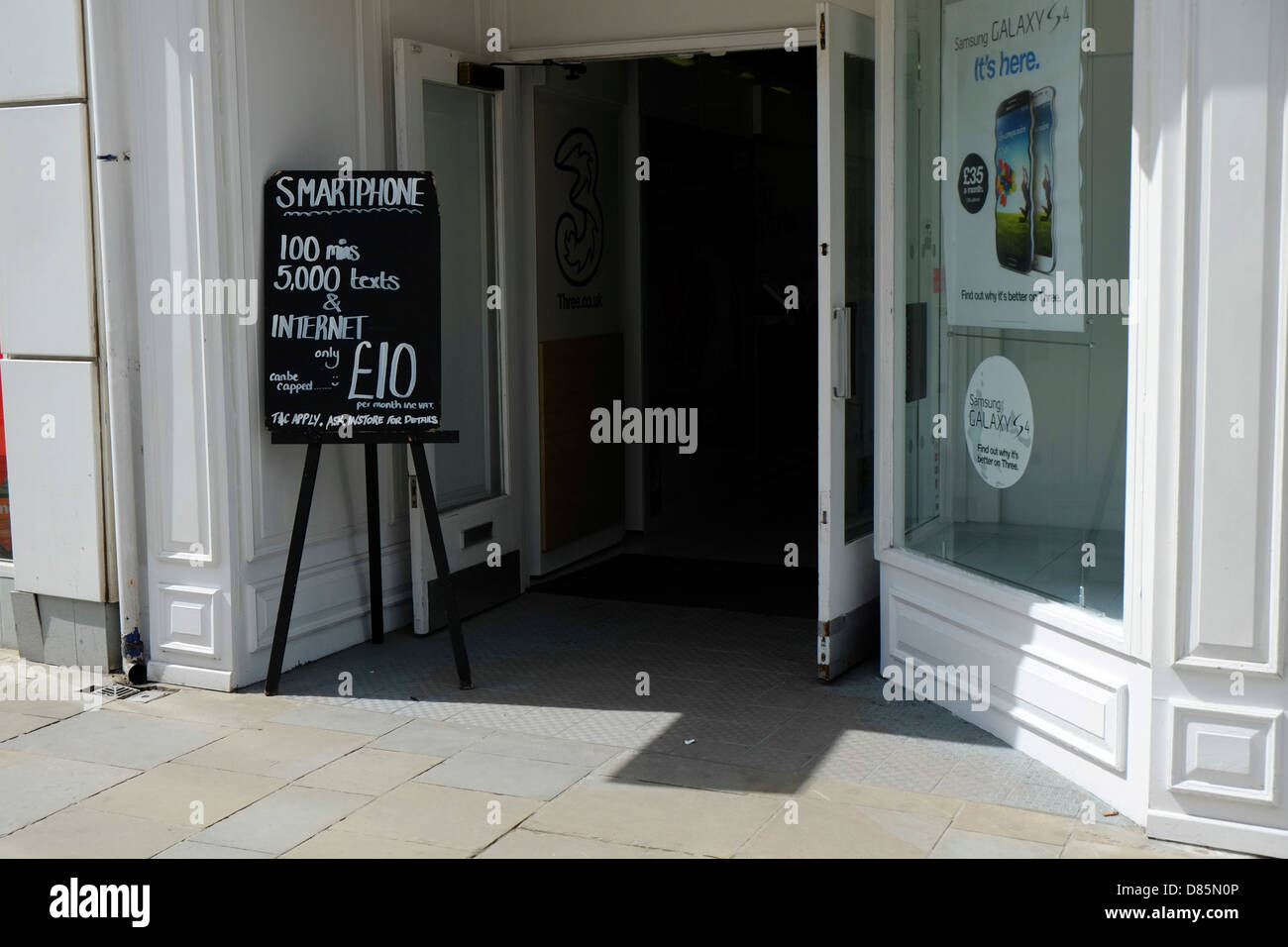 Three mobile network special offer board. Smart phones Stock Photo - Alamy