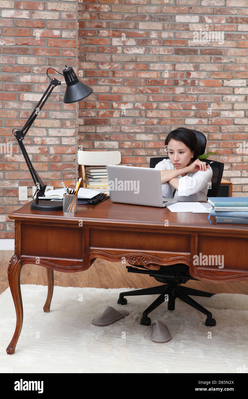 young woman sitting desk computer Stock Photo - Alamy
