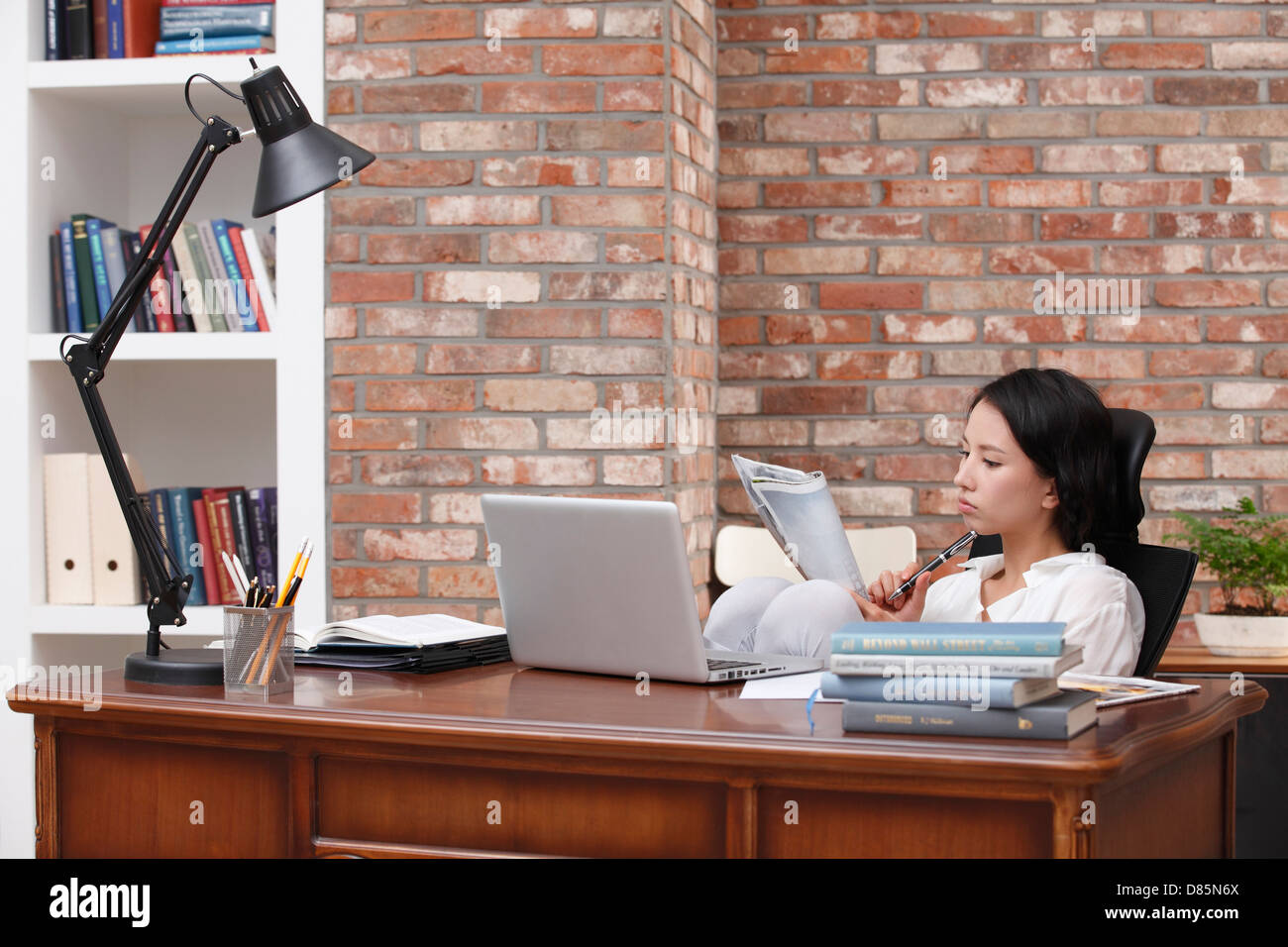 young woman sitting desk computer Stock Photo - Alamy