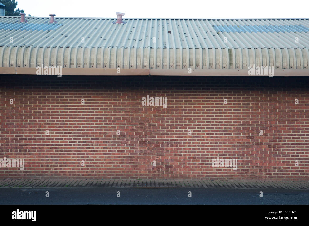brick wall side view of warehouse and metal warehouse roof Stock Photo ...