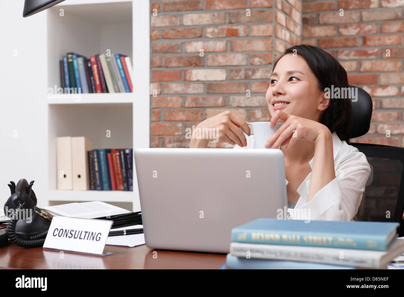 young woman sitting desk computer Stock Photo - Alamy