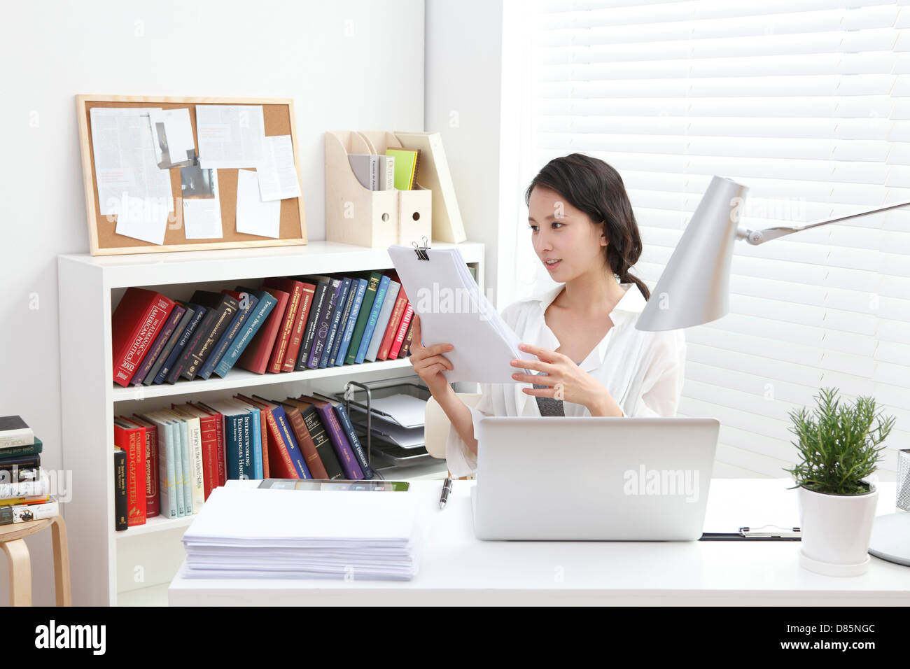 young woman sitting desk computer Stock Photo - Alamy