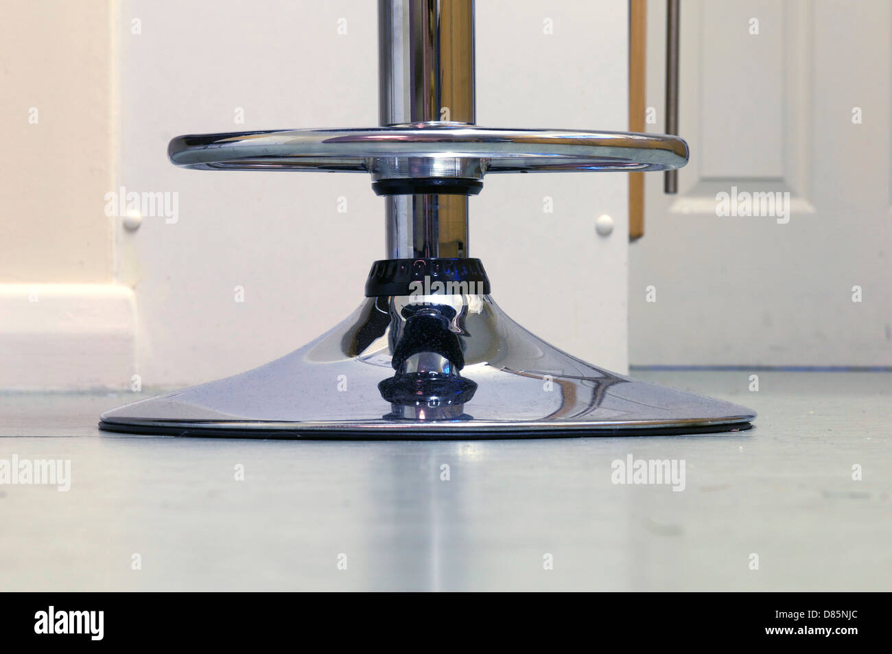 stool base in chrome with foot rest on kitchen floor Stock Photo - Alamy
