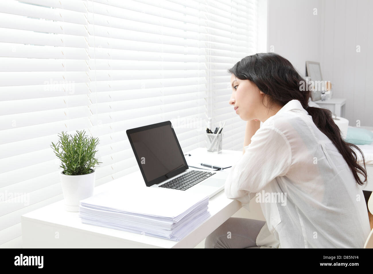 young woman sitting desk computer Stock Photo - Alamy