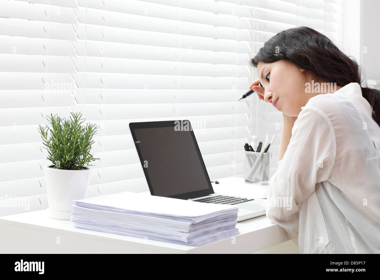 young woman sitting desk computer Stock Photo - Alamy