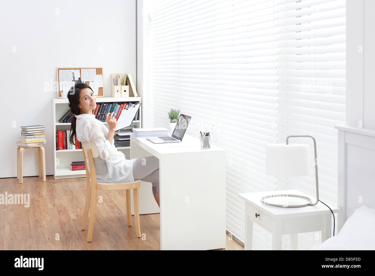 young woman sitting desk computer Stock Photo - Alamy