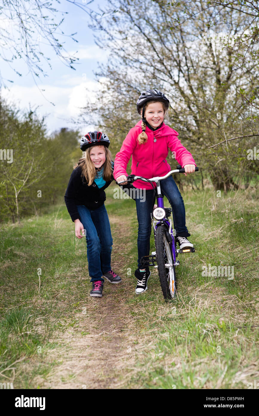 A cycling girls in front of rural landscape Stock Photo - Alamy