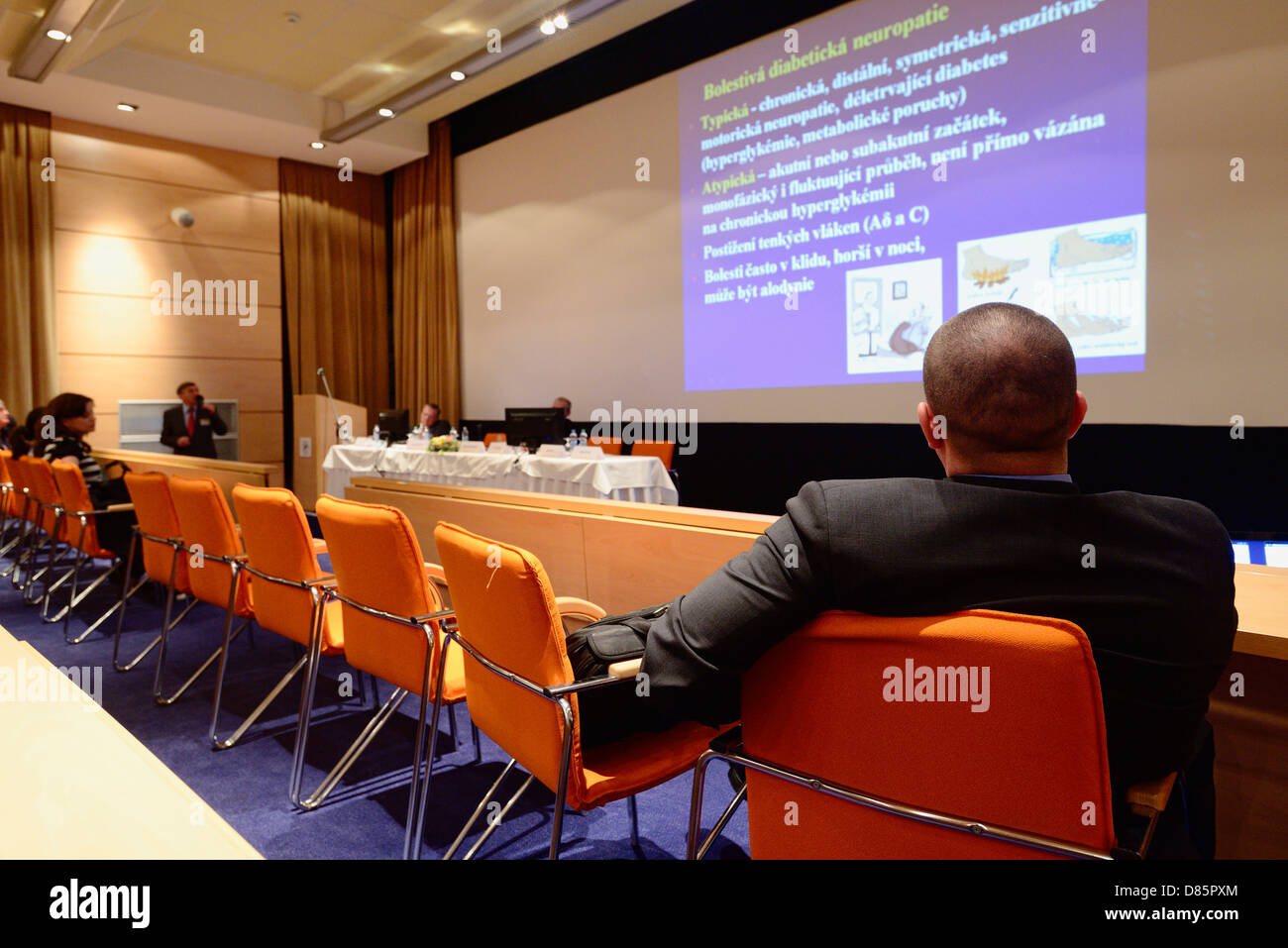 Audience member listening during a professional presentation Stock ...