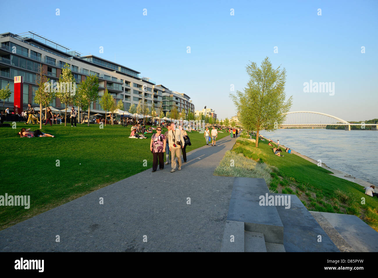 Eurovea shopping mall with rich green grass promenade along the River ...