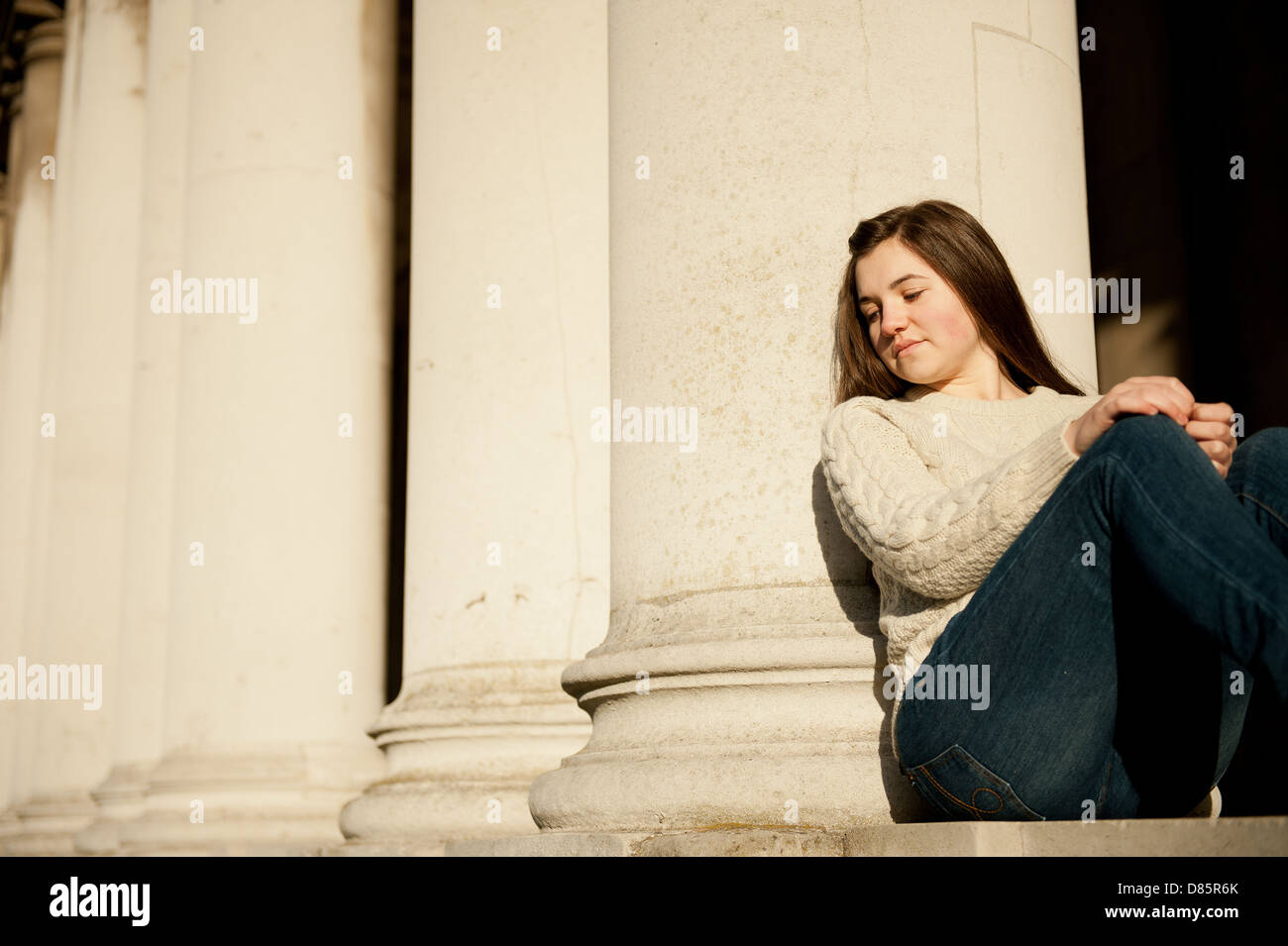 Girl leaning against column hi-res stock photography and images - Alamy