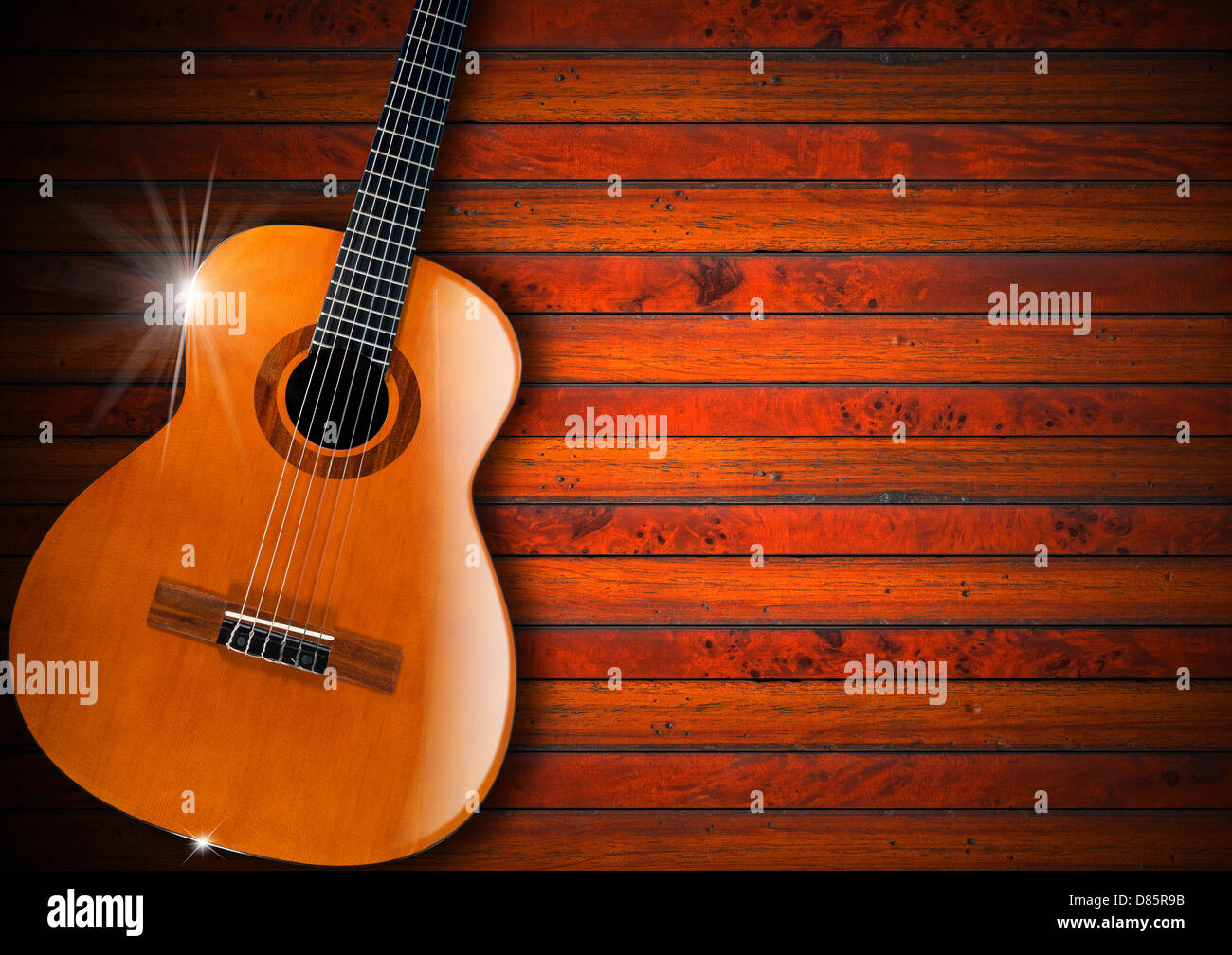 Acoustic Guitar on Wood Background Stock Photo - Alamy
