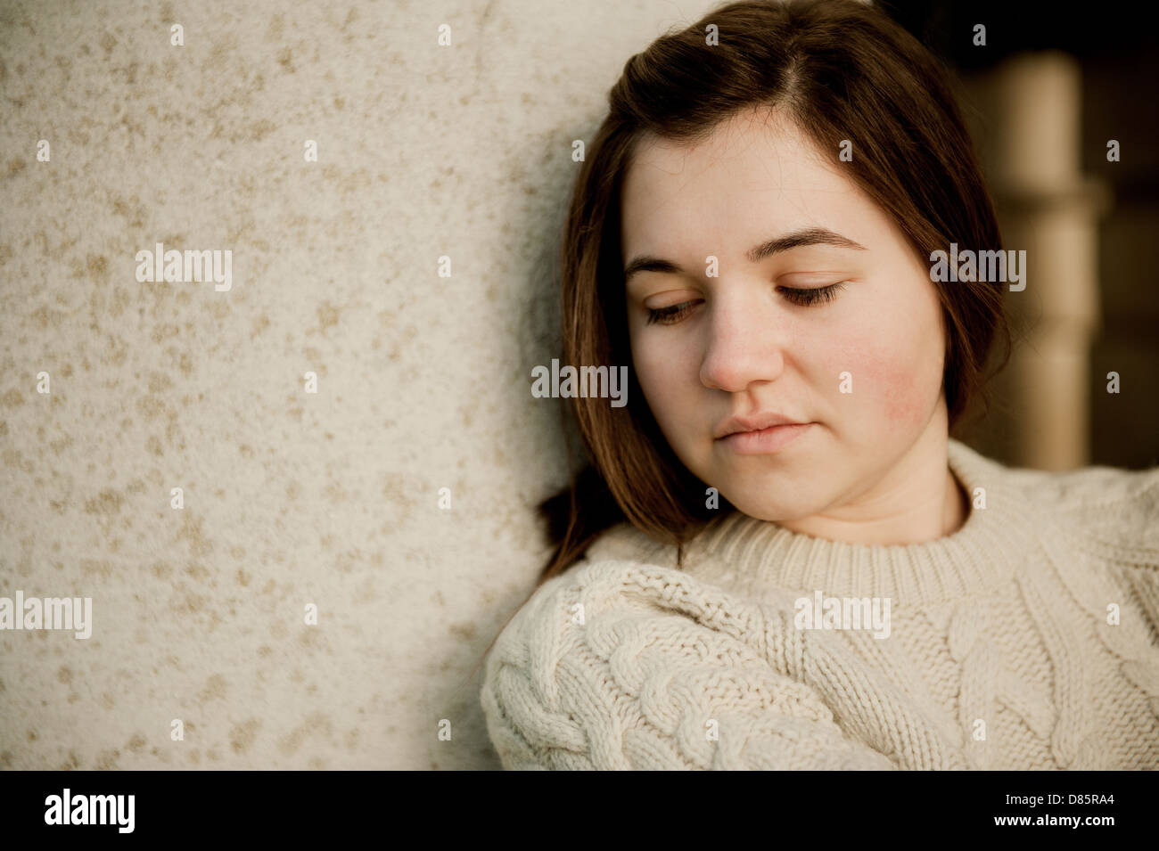 Portrait of a teenage girl in deep thought Stock Photo - Alamy