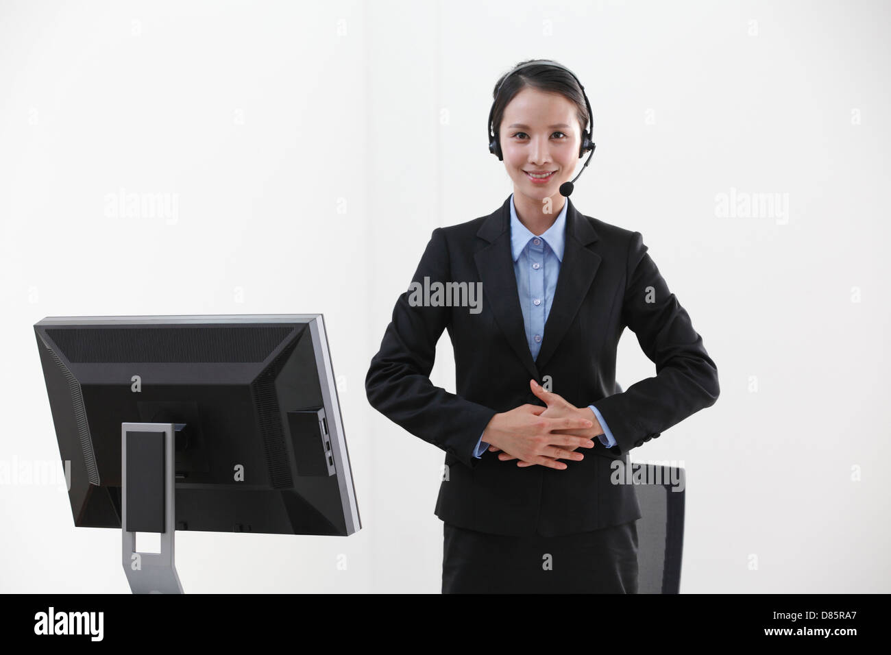 business woman standing desk in office Stock Photo - Alamy