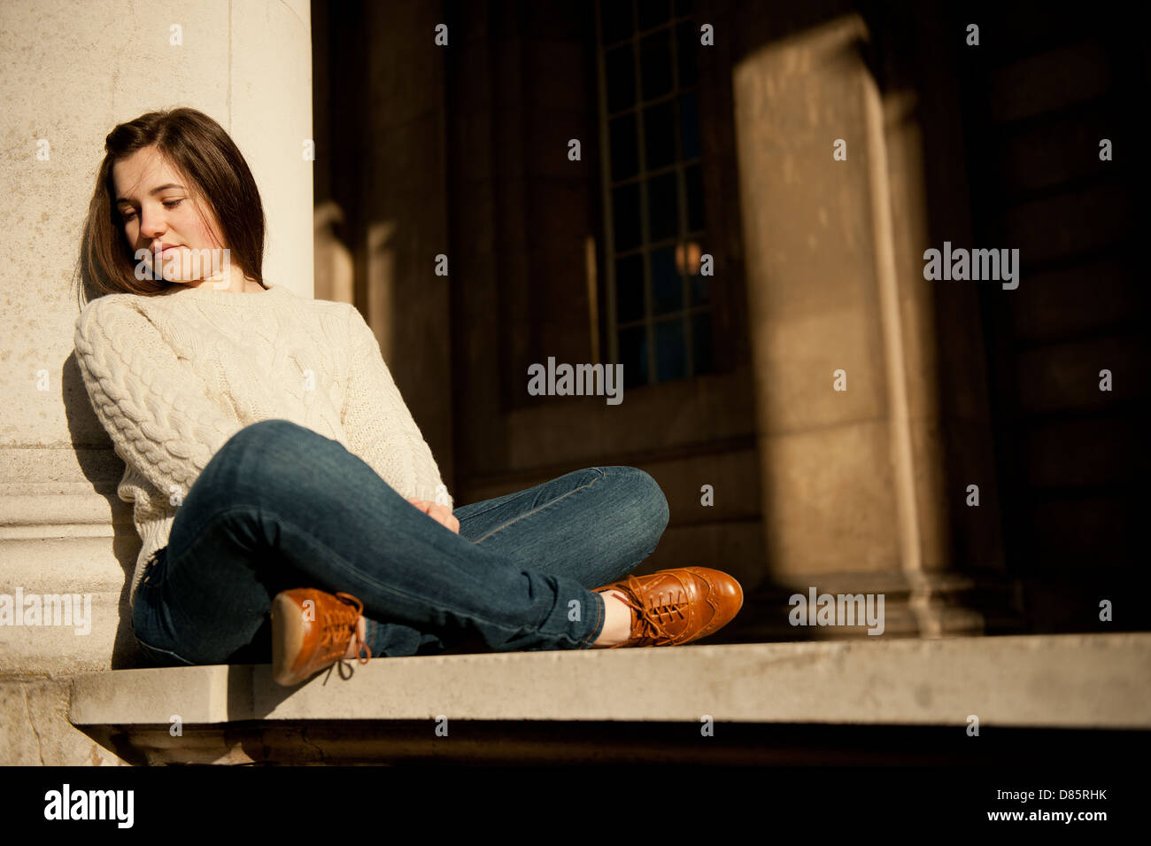 Girl leaning against column hi-res stock photography and images - Alamy