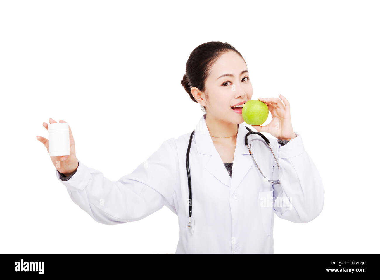 The young female doctor to eat apple Stock Photo - Alamy