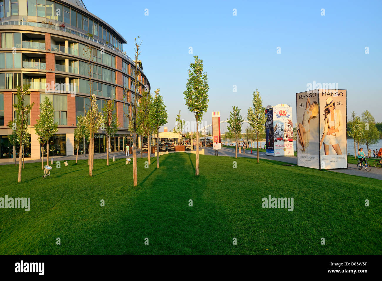 Eurovea shopping mall with rich green grass promenade along the River ...