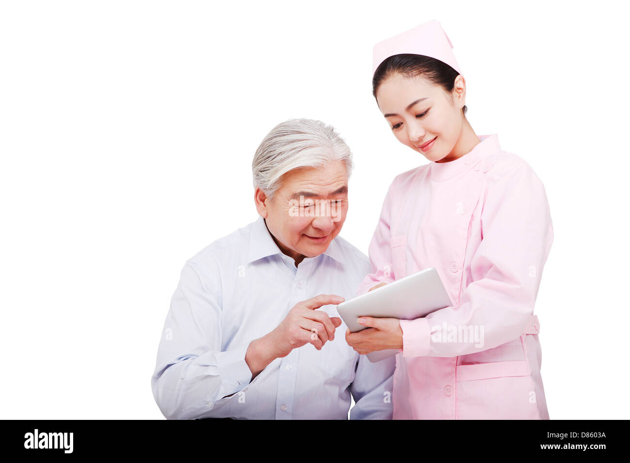 Nurses guide patients to use IPAD Stock Photo - Alamy