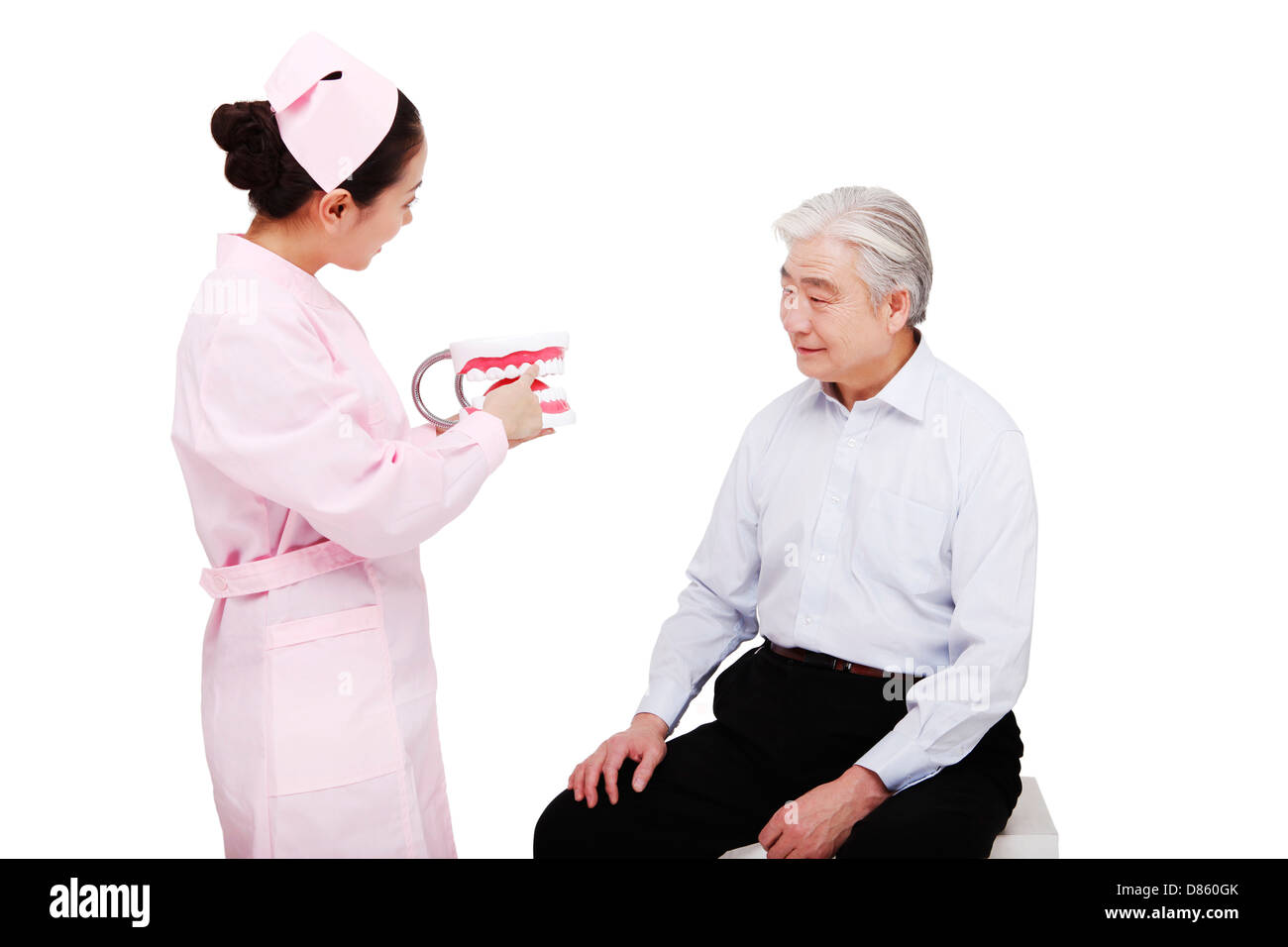 Dental clinic staff to explain teeth matters needing attention Stock ...