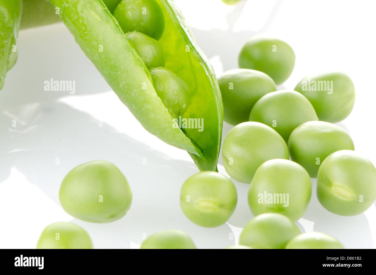 Fresh green pea pod on white background Stock Photo - Alamy