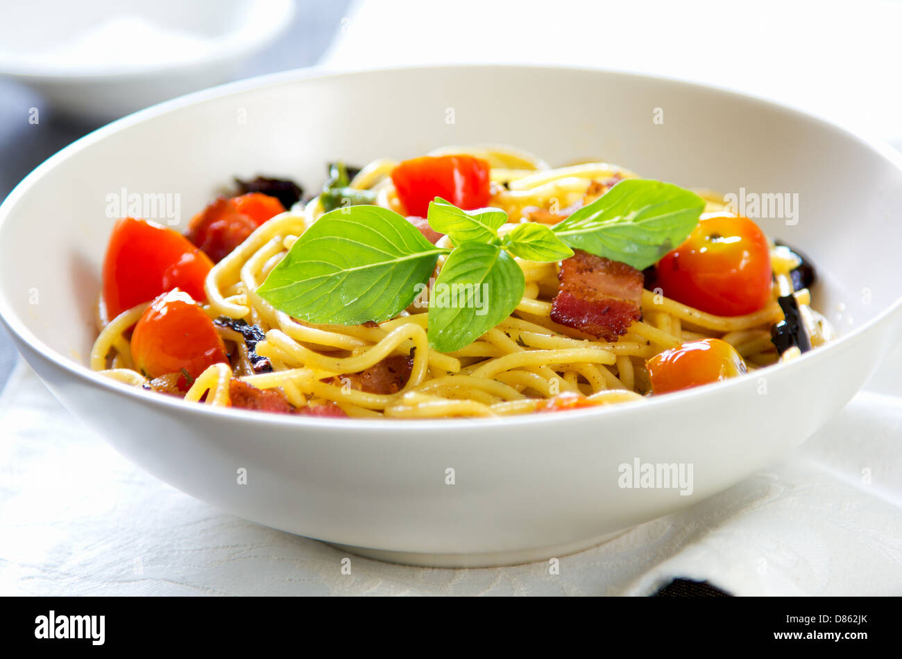Spaghetti with bacon,tomato and dried chilli Stock Photo - Alamy